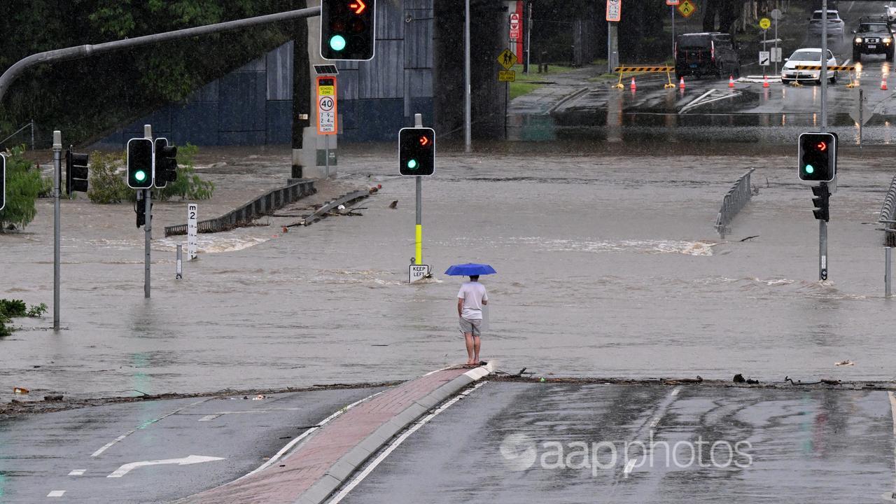 Heavy rain causes floods in Australia as tropical cyclone looms - Oz ...